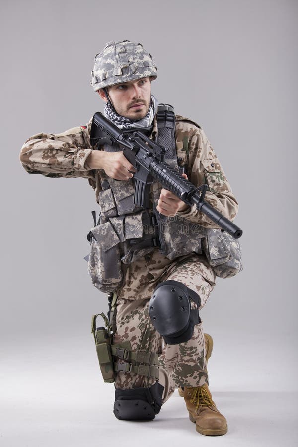 Kneeling Soldier with Machine Gun Stock Photo - Image of defending ...