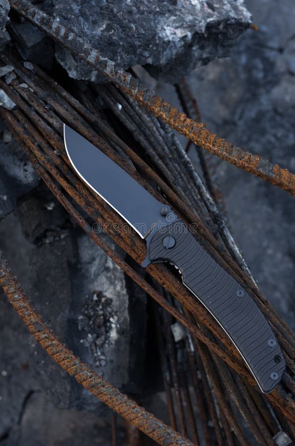 The Knife is at an Angle. the Knife is Diagonal. Sharp Black Knife ...