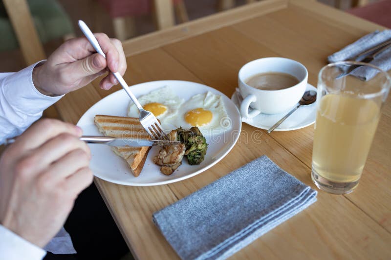 Knife and Fork in Hand. Breakfast on the Table.. American Style ...