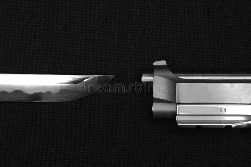 Knife And Gun Pointing Towards Each Other Picture. Image: 4034847