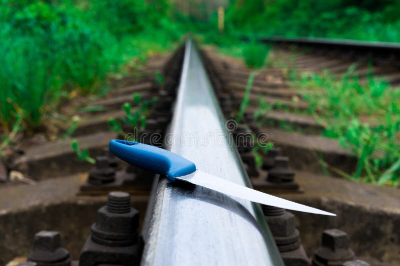 Knife in a Hands on the Rails, Railroad Stock Photo - Image of crime ...