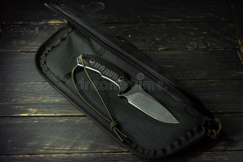 Knife Inside the Clutch. the Knife Inside the Bag Stock Photo - Image ...