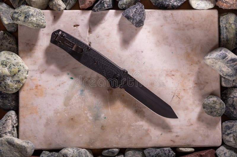 The Knife is Located in the Frame. Knife on a Marble Board. Top Stock ...
