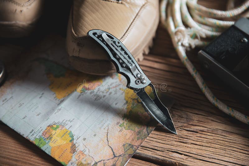 Knife on map on the desk. stock image. Image of cartography - 241950101
