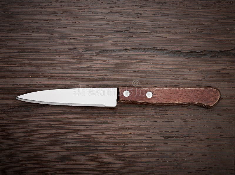 Knife on Rustic Kitchen Table Stock Image - Image of board, brown: 22895293