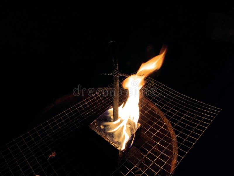 Knife in the Shape of a Cross in a Burning Fire Stock Image - Image of ...