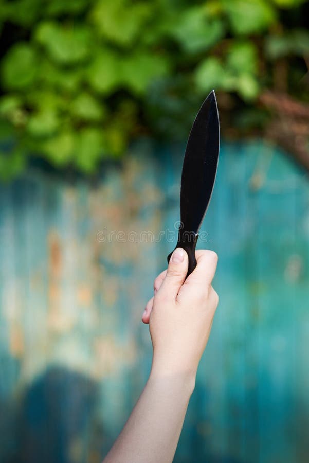 Knife for Throwing in the Hand of a Woman, Game for Active Recreation ...