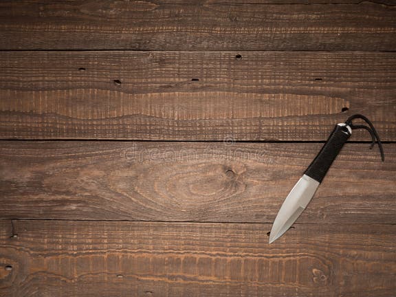 Knife for Throwing on a Wooden Table Stock Photo - Image of table ...
