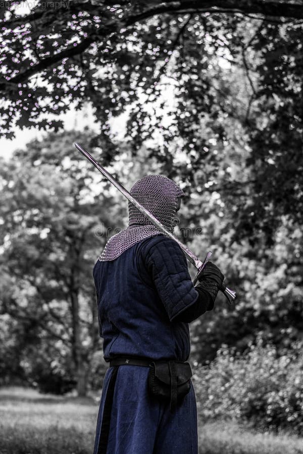 A Knight in Light Armor with a Sword Resting on His Neck. Black and ...