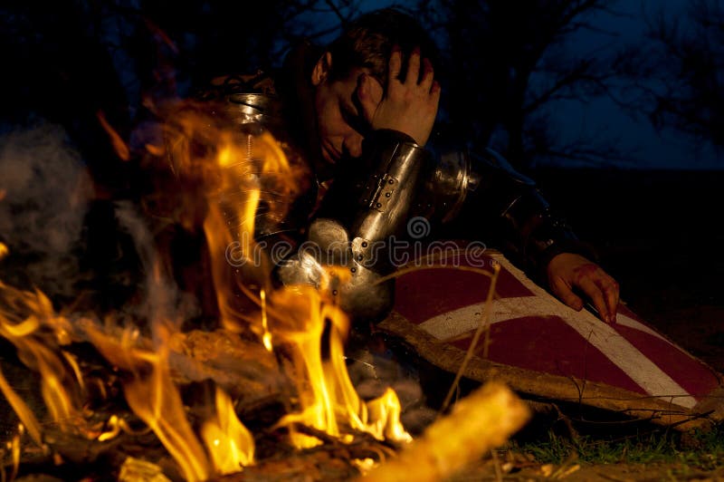 Knight near the fire stock image. Image of historic, fire - 31574613