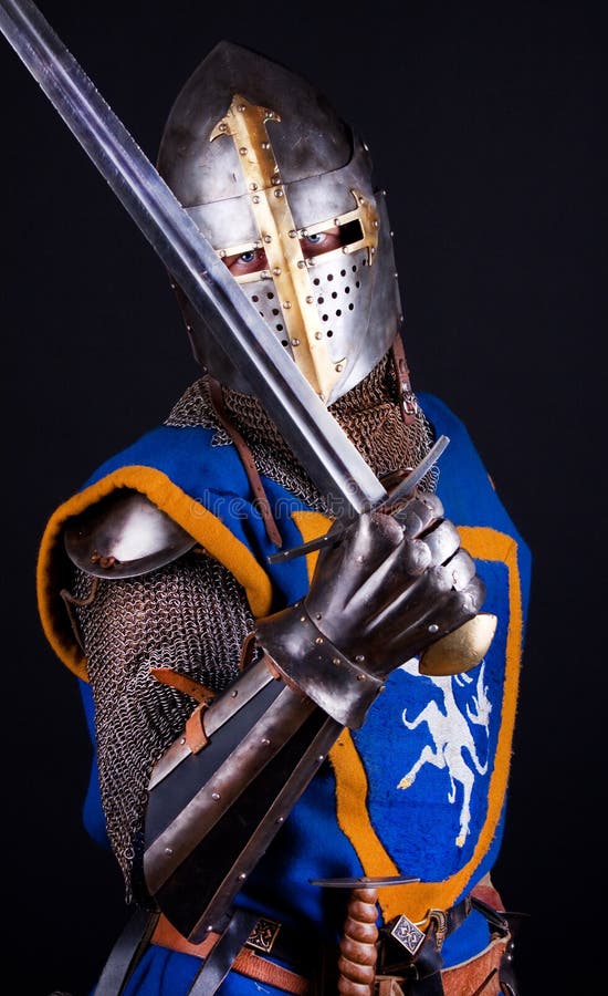 Knight posing with sword stock image. Image of armour - 13314055