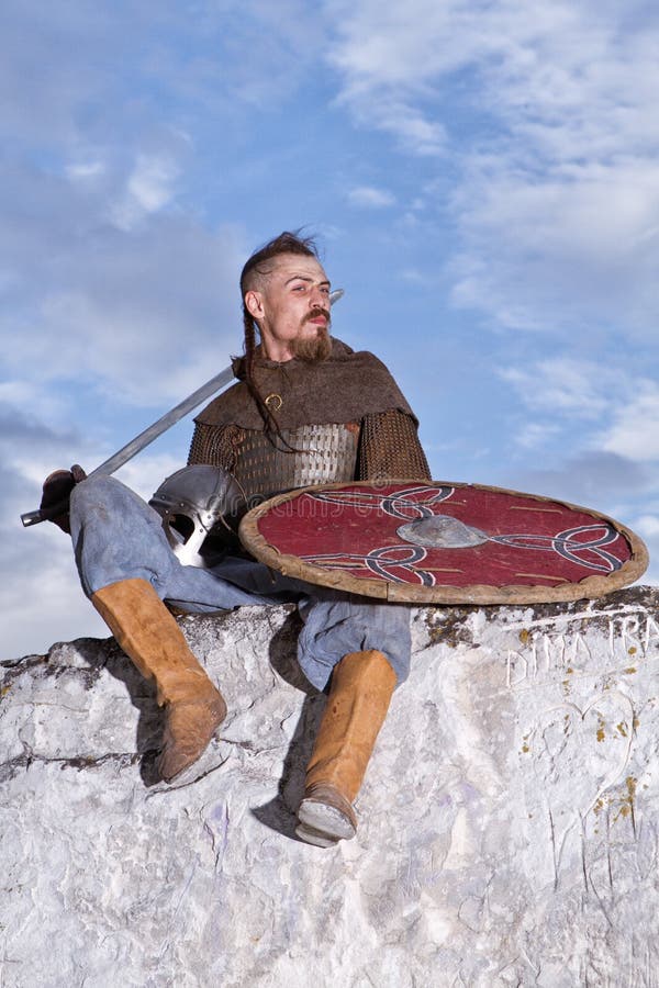 Knight sitting on a rock stock image. Image of portrait - 35478443
