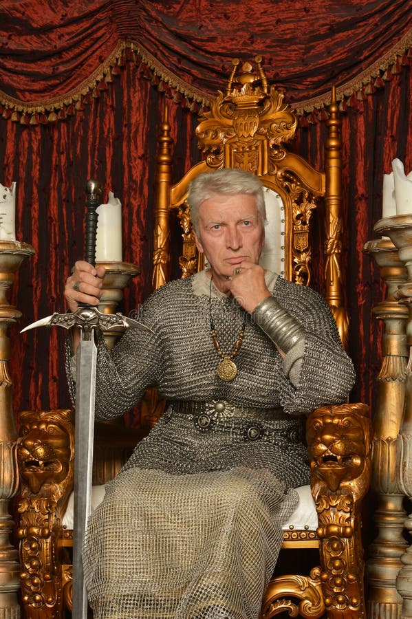 Knight on the throne stock photo. Image of blade, armored - 79308570