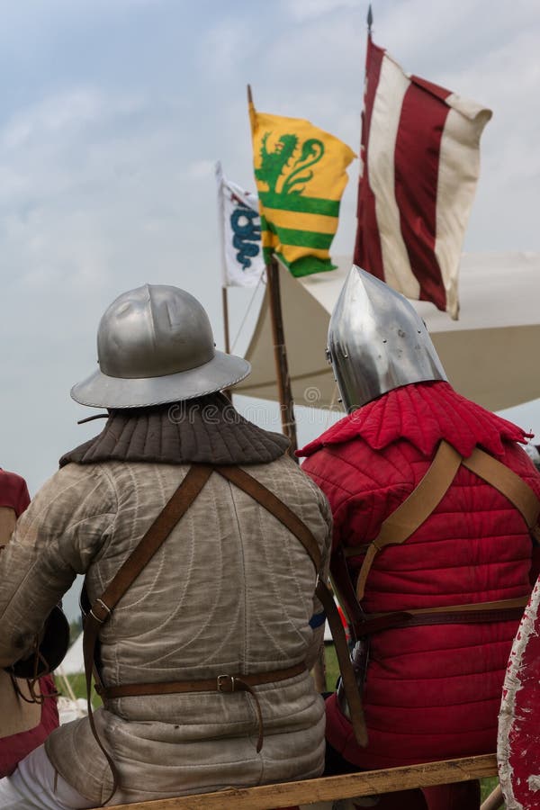 Knights with Silver Helmets and Shields Seated on Chair Stock Photo ...