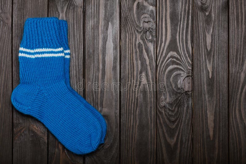 Knit Blue Wool Socks on Dark Wooden Background. Stock Image - Image of ...
