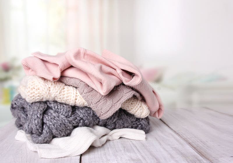 Knitted Clothes on Wooden Table Empty Copy Space. Stock Image - Image ...