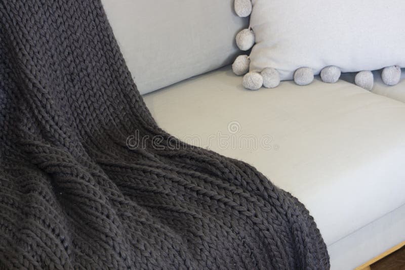 A Knitted Grey Throw Rug on a Sofa Stock Image - Image of accessory ...