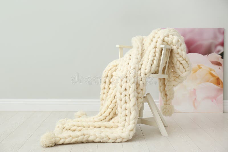 Knitted Merino Wool Plaid on Chair in Room. Space for Text Stock Image ...