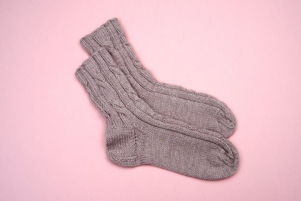 Knitted Wool Socks on a Pink Background Stock Photo - Image of sock ...