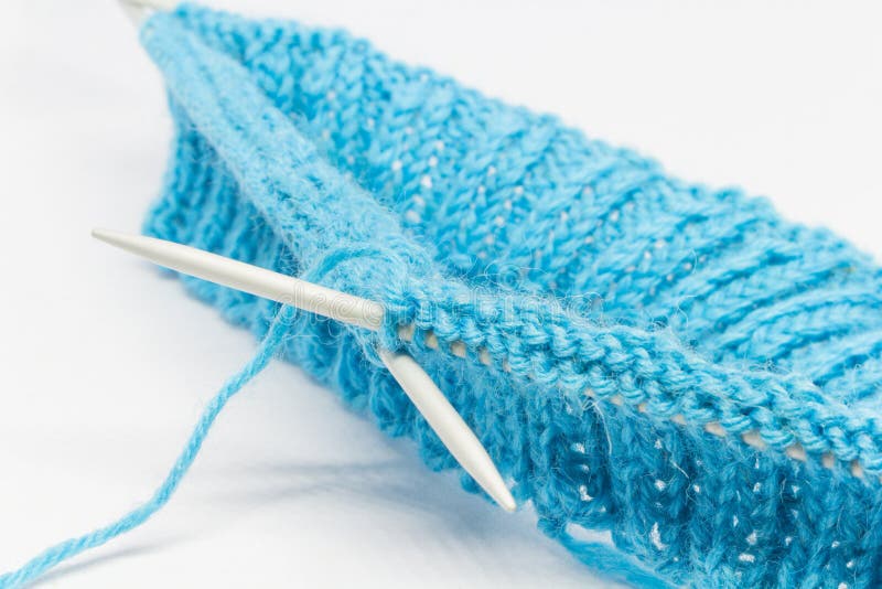 Knitting with a blue wool stock photo. Image of material - 113522058
