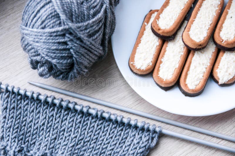 Knitting with Grey Wool and Cookies on White Plate Stock Image - Image ...