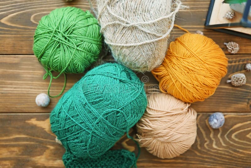 Knitting Yarn on Wooden Table Stock Photo - Image of green, material ...