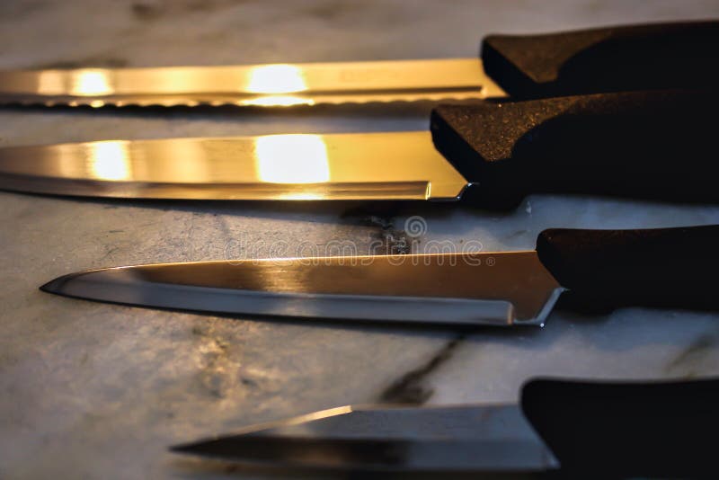 Knives on a table stock photo. Image of professional - 140232318