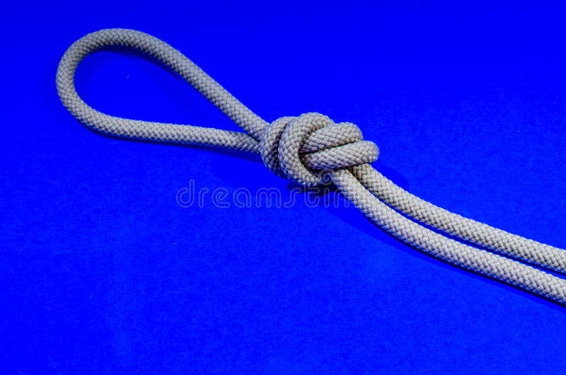 Knot with Loop in Front of Blue Background Stock Image - Image of ...