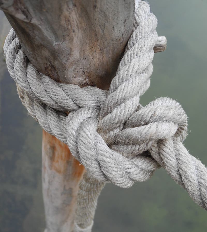 Knot Of Thick Rope Tied Around A Wooden Stake Stock Photo - Image of ...