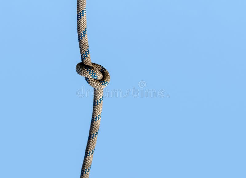 Knot on a Rope on a Blue Background Stock Image - Image of close ...
