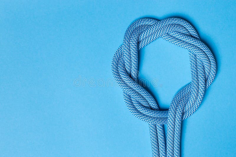 Knot on a Rope on a Blue Background. Stock Photo - Image of braid, knot ...