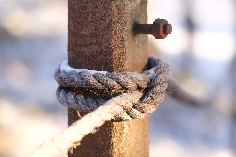 Knot on a stone pillar stock photo. Image of rust, detail - 365130636