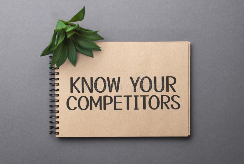 KNOW YOUR COMPETITORS Text on Craft Colored Notepad and Green Plant on ...