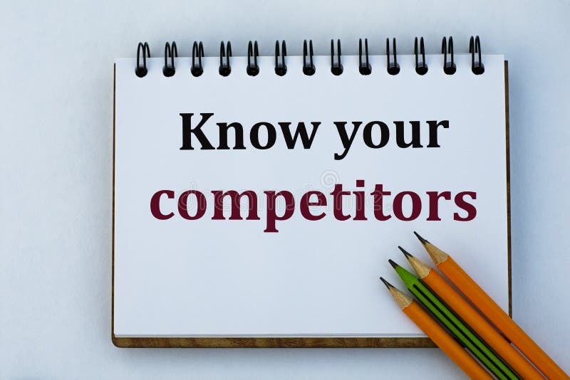 KNOW YOUR COMPETITORS - Words on a White Sheet of Notebook and Pencils ...