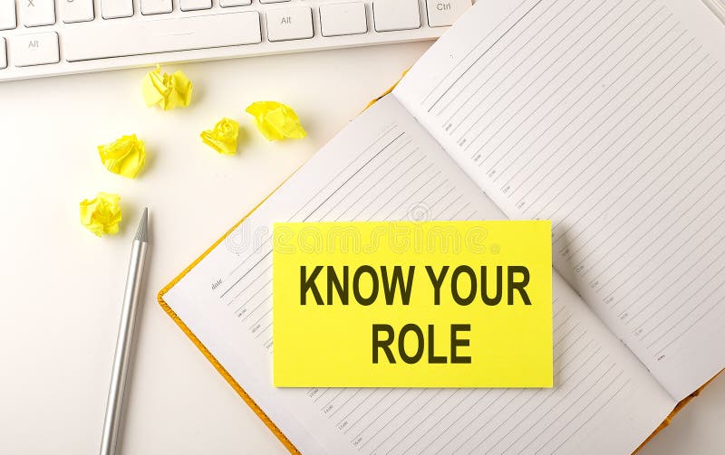 KNOW YOUR ROLE Text on the Sticker on the Diary with Keyboard and ...