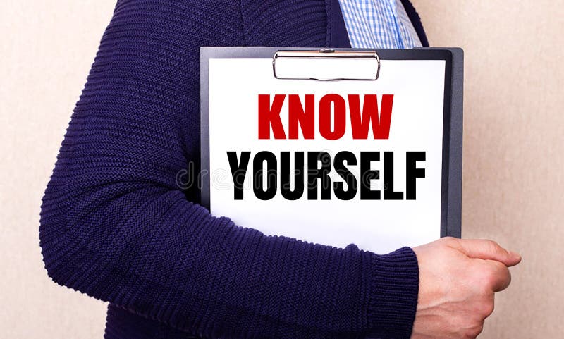 KNOW YOURSELF is Written on a White Sheet Held by a Man Standing ...