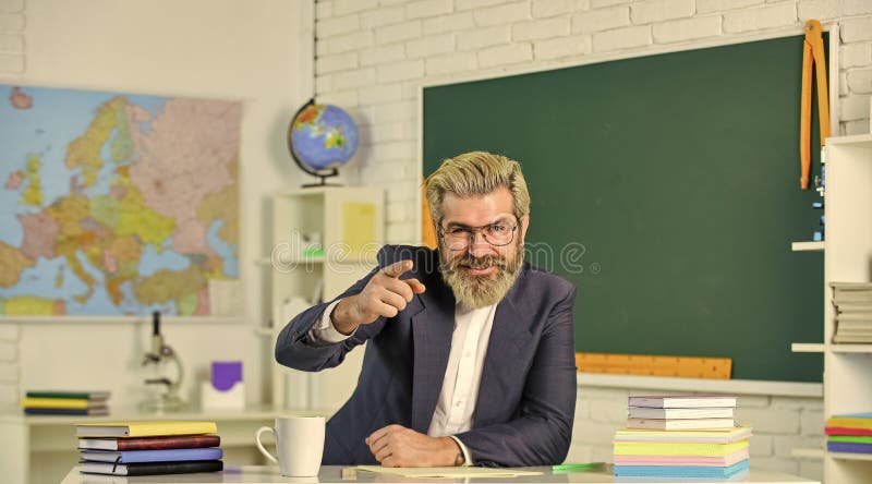 Knowledge Day. Man School Teacher Sit in Classroom. Handsome Mature ...