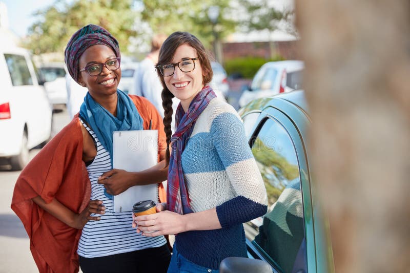 Knowledge is Empowering. Portrait of Two University Students Hanging ...