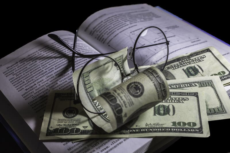 Knowledge is Money. Book, Banknotes and Glasses Stock Photo - Image of ...