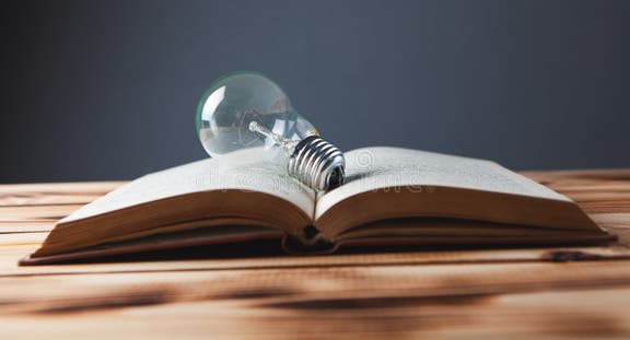 Knowledge and Wisdom, Light Bulb on the Book Stock Image - Image of ...