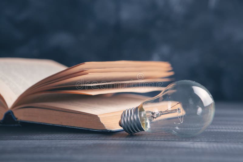 Knowledge and Wisdom, Light Bulb on the Book Stock Image - Image of ...