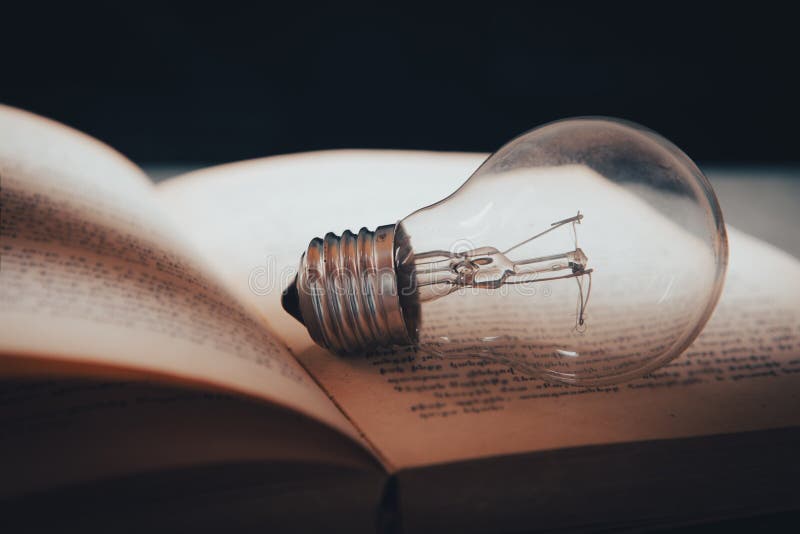 Knowledge and Wisdom, Light Bulb on the Book Stock Image - Image of ...