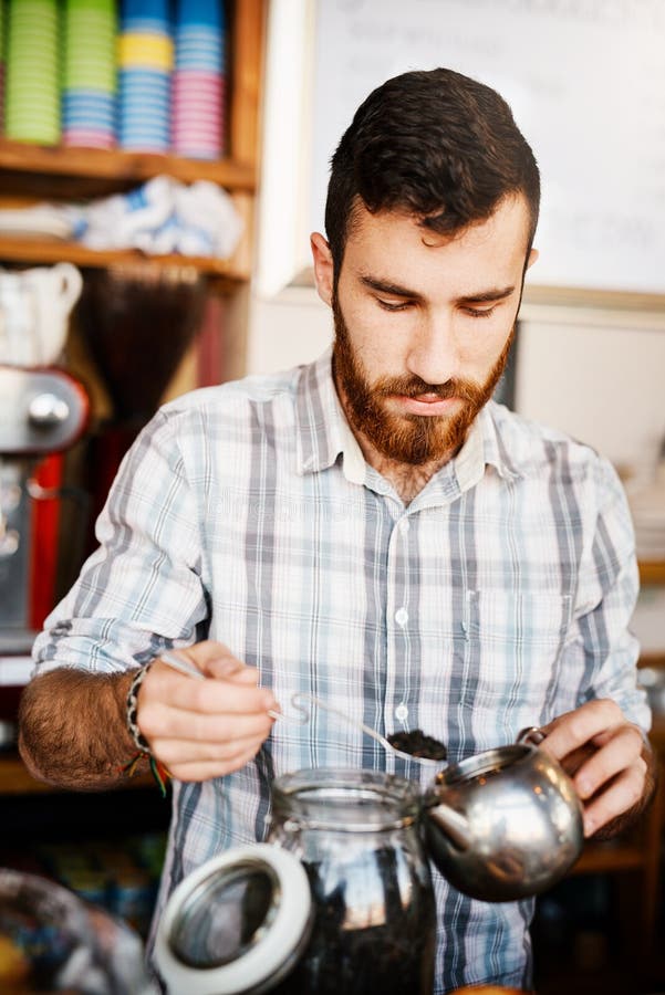 He Knows His Blends. a Barista Making Coffee in His Coffee Shop. Stock ...