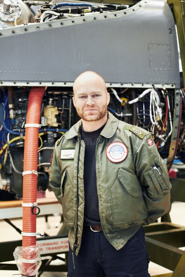 Portrait of Man, Pilot in Military with Jet and Confident Smile at ...