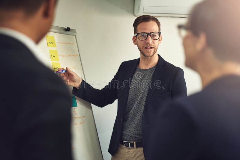 He Knows What it Takes To Succeed. a Young Man Giving a Presentation To ... He Knows What it Takes To Succeed. a Young Man Giving a Presentation To ...