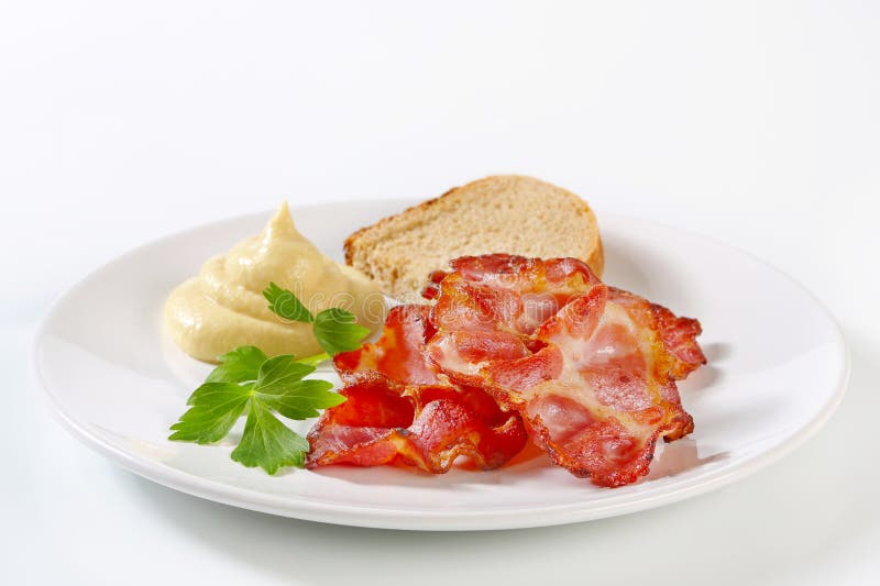 Knusperiger Speck Mit Brot Und Senf Stockbild - Bild von brot, würzig ...