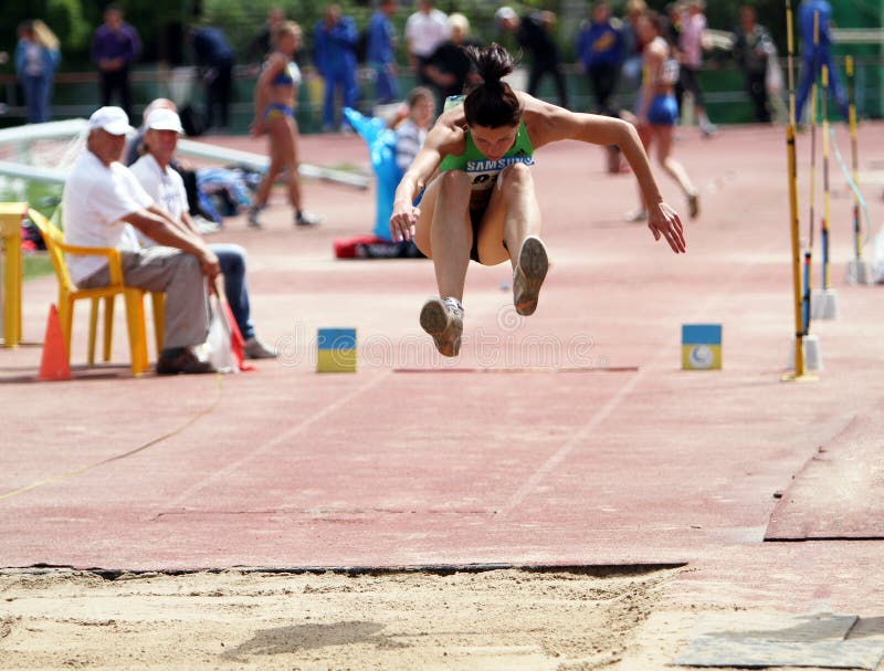 Girl on the triple jump editorial image. Image of challenge - 23887100
