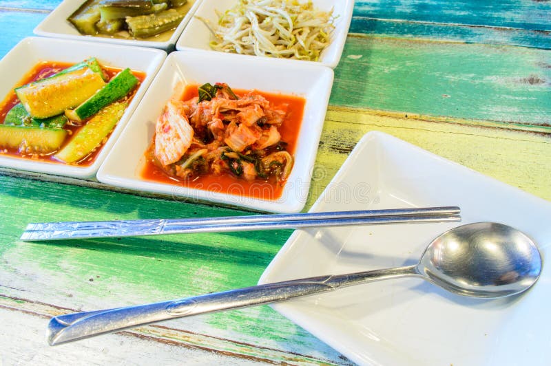 Kimchi on White Square Dish with Spoon and Chops Stock Image - Image of ...