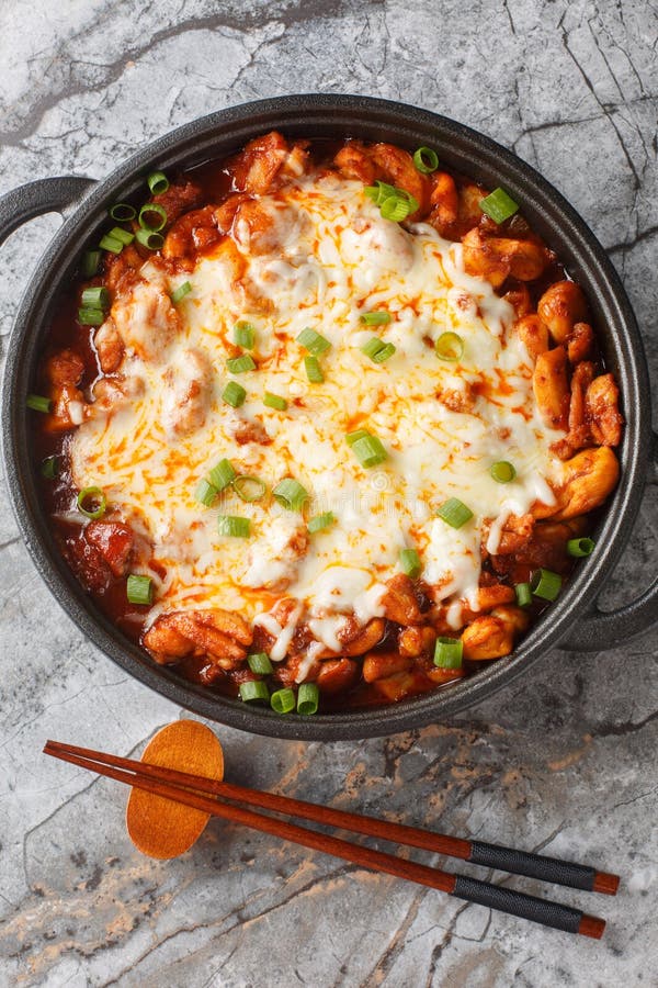 Korean Fire Chicken Cheese Buldak with Gochujang Paste Closeup on the ...