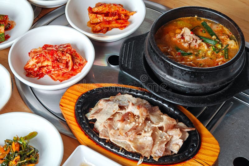 Korean Grilled Sliced Meat and Soy Bean Paste Soup with Side Dishes ...